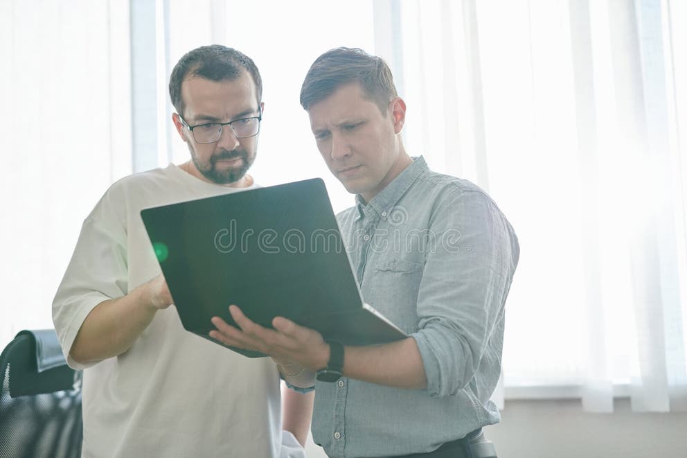 Portrait of Two Professional Male Programmers Working on Computer in ...