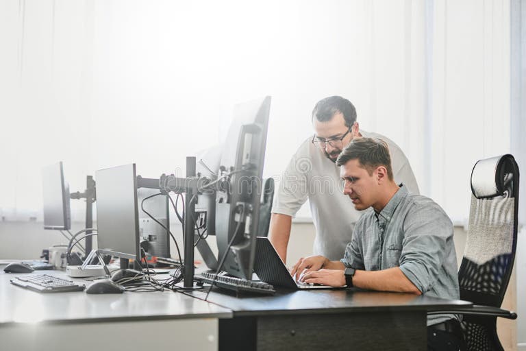 Portrait of Two Professional Male Programmers Working on Computer in ...