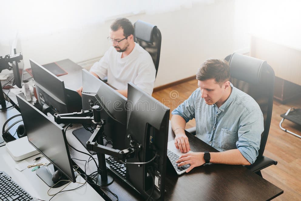 Portrait of Two Professional Male Programmers Working on Computer in ...