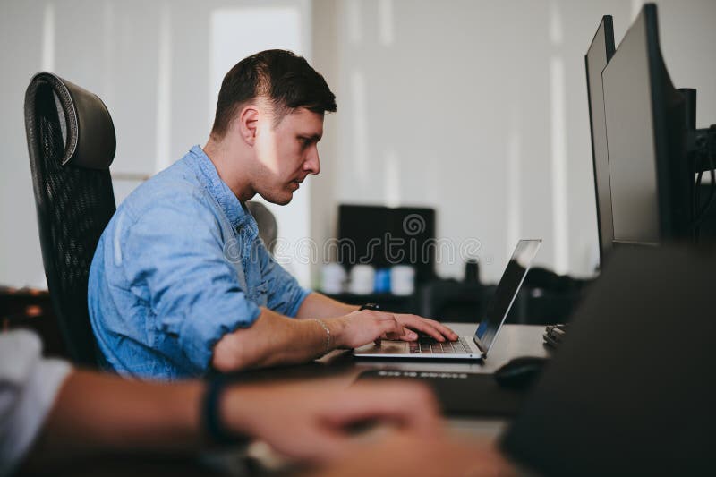 Portrait of Two Professional Male Programmers Working on Computer in ...