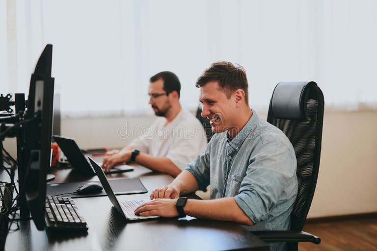 Portrait of Two Professional Male Programmers Working on Computer in ...