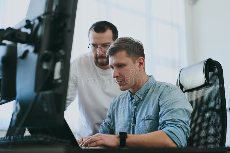 Portrait of Two Professional Male Programmers Working on Computer in ...