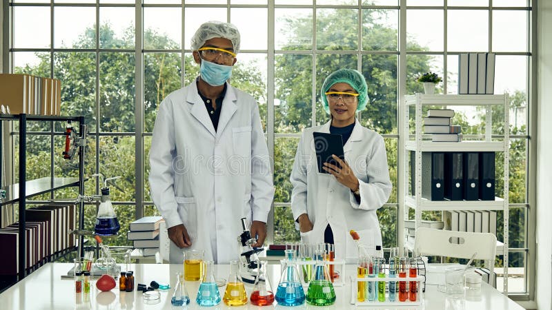 Portrait of Two Scientists Standing with Digital Tablet in Laboratory ...