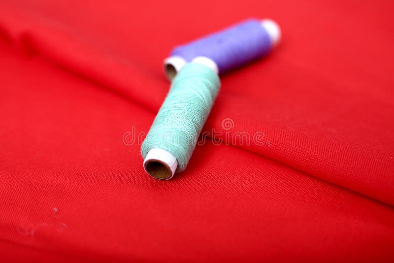 Portrait of Two Sewing Thread on the Red Cloth Stock Image - Image of ...