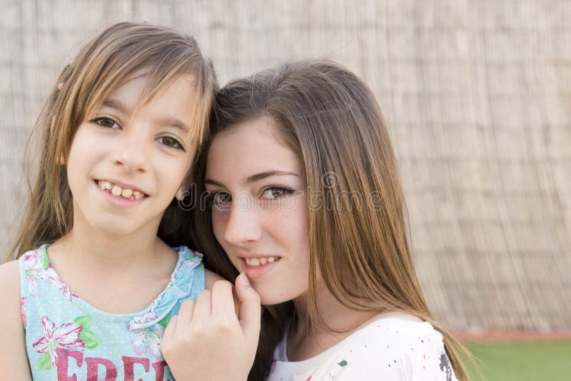 Portrait of two sisters stock image. Image of young, family - 72370809