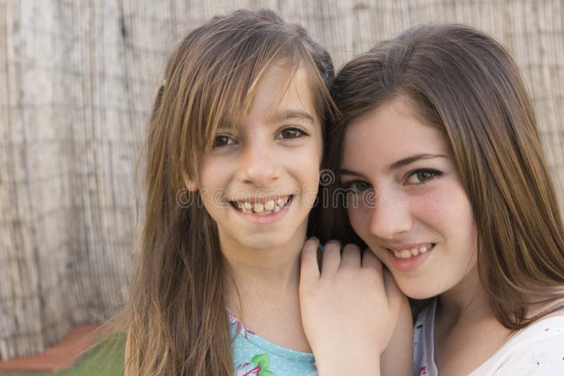 Portrait of two sisters stock image. Image of person - 72370935