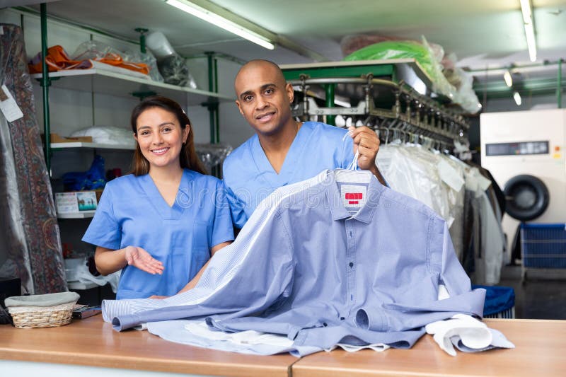 Portrait of Two Workers of Dry-cleaning Facility Stock Photo - Image of ... Portrait of Two Workers of Dry-cleaning Facility Stock Photo - Image of ...