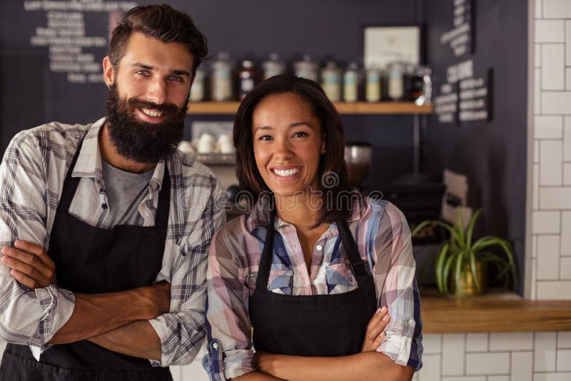 Portrait of two waiters stock photo. Image of mixedrace - 77688444