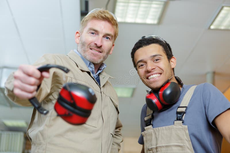 Portrait Two Workmen with Earmuffs Stock Image - Image of manager ...