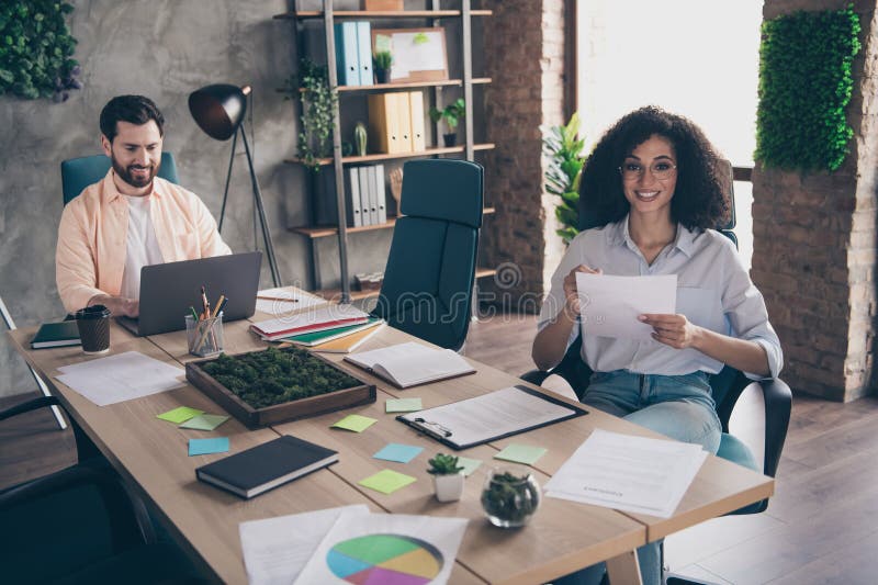 Portrait of Two Young Corporate Workers Laptop Documents Modern Loft ...