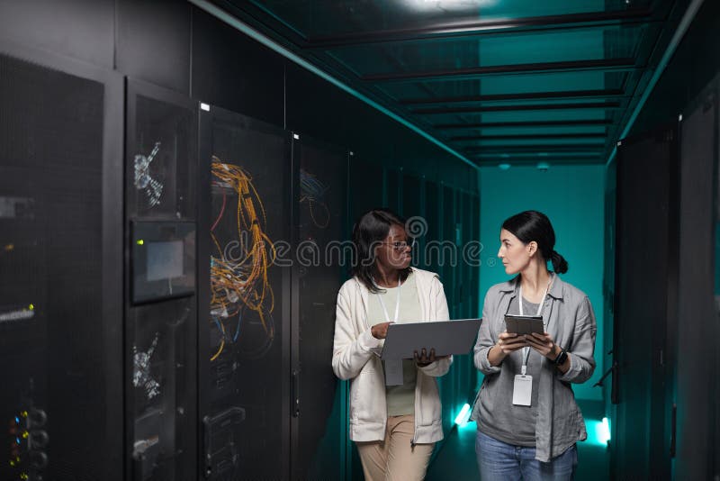 Two Women Managing Servers in Data Center Stock Photo - Image of ...