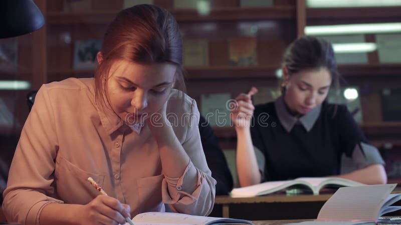 Portrait of Students Sitting in Library and Studying Stock Video ...