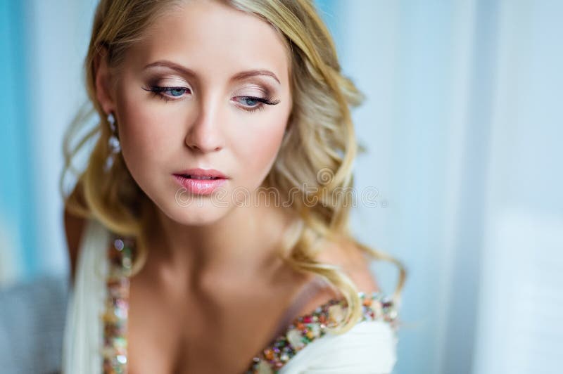 Portrait Of A Very Beautiful Blonde Girl With Blue Eyes Stock Image