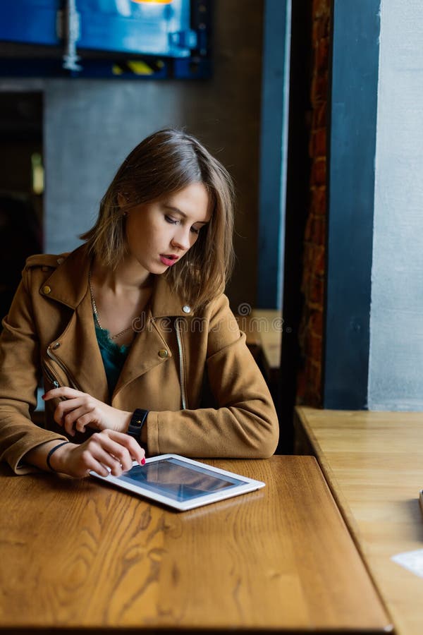 Portrait of a Very Pretty Girl with a Tablet in a Cafe. Stock Image ...