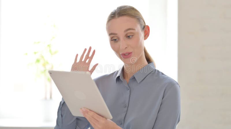 Portrait of Video Call on Tablet by Woman in Office Stock Photo - Image ...
