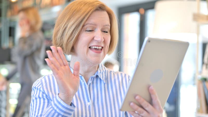 Portrait of Video Chat on Tablet by Creative Old Woman Stock Image ...