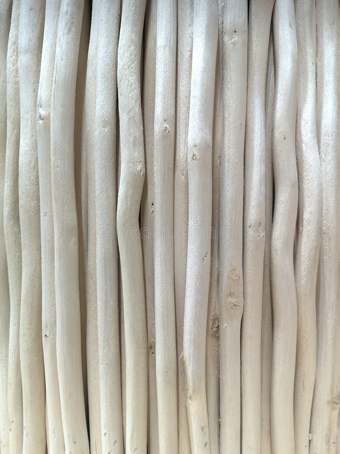 A Portrait View of a Lined-up Stack of Debarked Wood Sticks, Light in ...