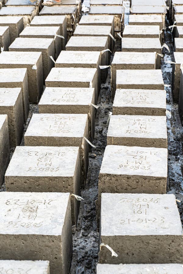 Granite Bolder in Infront of River. a Pile of Four Square Cinder Blocks ...
