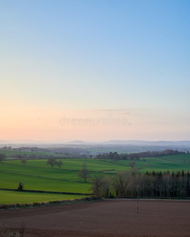 Portrait View of Rolling English Countryside with Blue Sky and Green ...