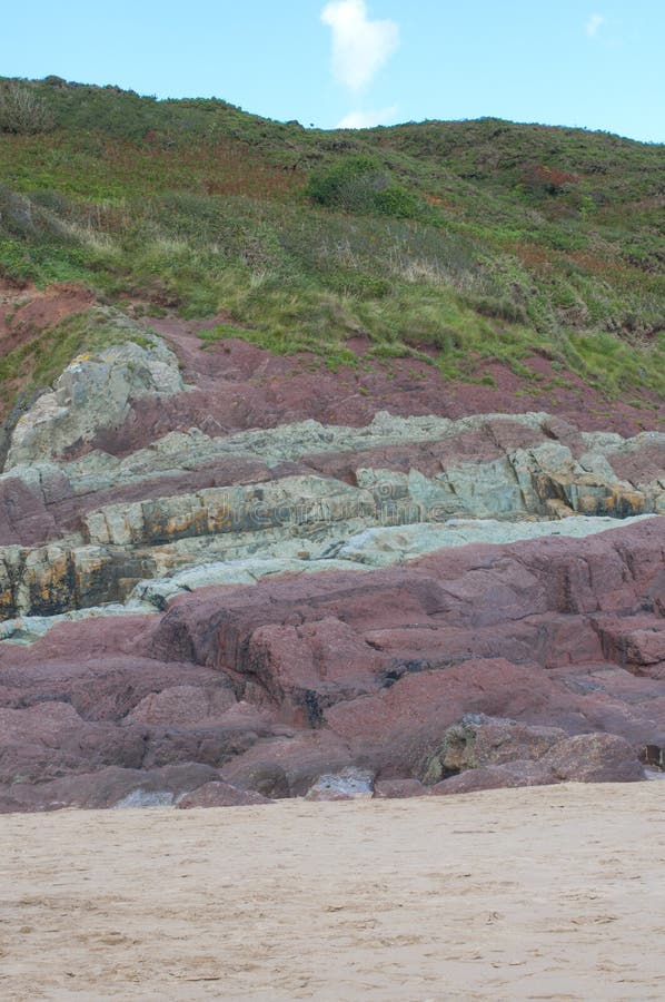 Portrait View of Sand, Red Rocks on a Beach Stock Image - Image of ...