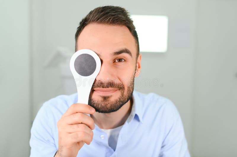 Portrait, Vision and Spoon with a Man Patient at the Optometrist for an ...