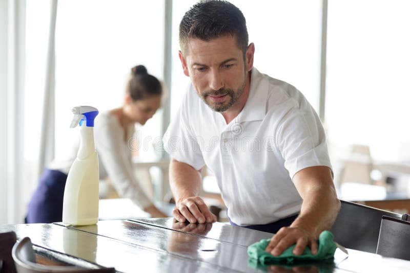 Portrait Waiter Cleaning Bar Stock Photo - Image of polish ...
