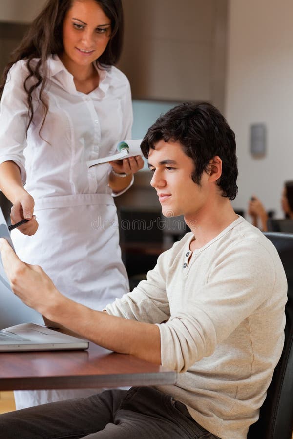 Portrait of a Waitress Advising a Customer Stock Image - Image of ...
