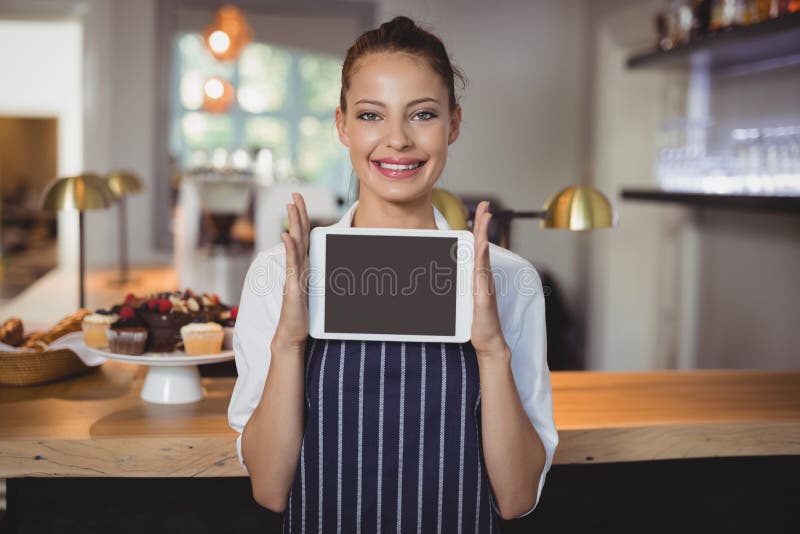 Portrait of Smiling Waitress Using Digital Tablet Stock Image - Image ...