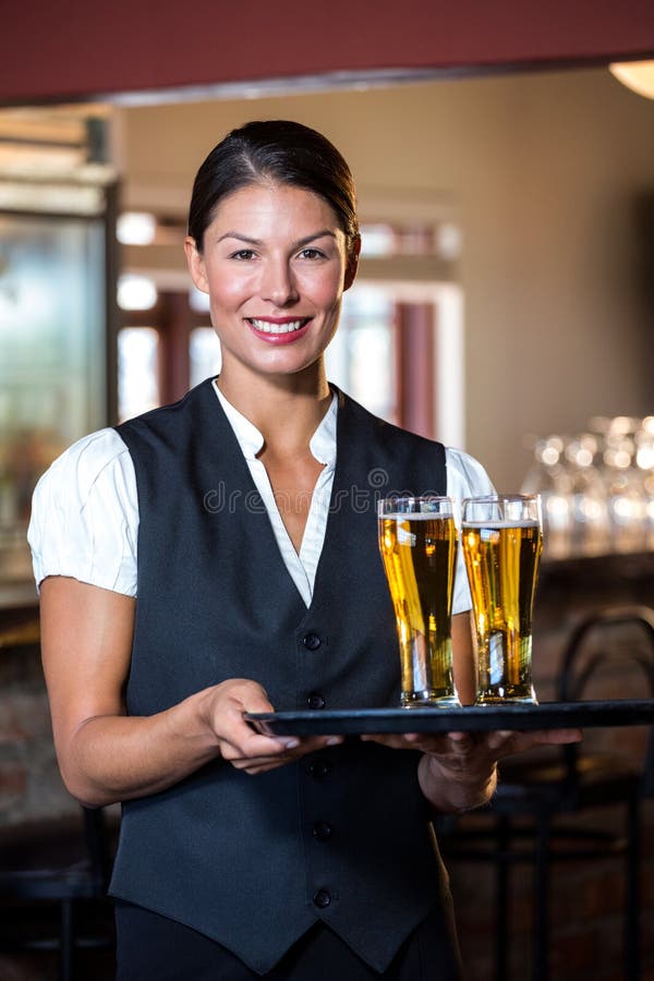 Portrait of Waitress Holding Serving Tray with Two Glass of Beer Stock ...