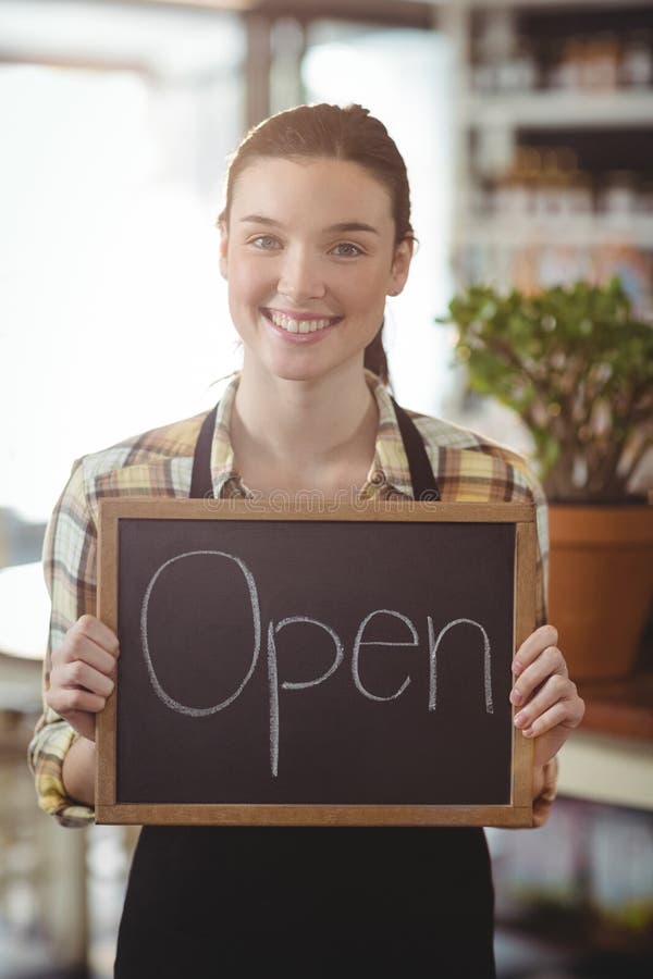 Portrait of Waitress Showing Chalkboard with Open Sign Stock Image ...