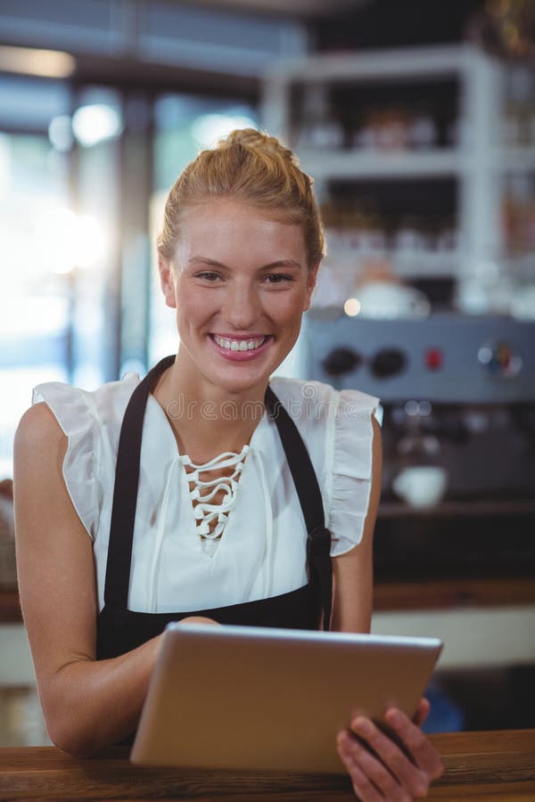Portrait of Waitress Standing at Counter Using Digital Tablet Stock ...
