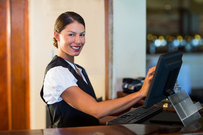 Waitress Using Digital Tablet while Waiter Preparing Coffee in ...