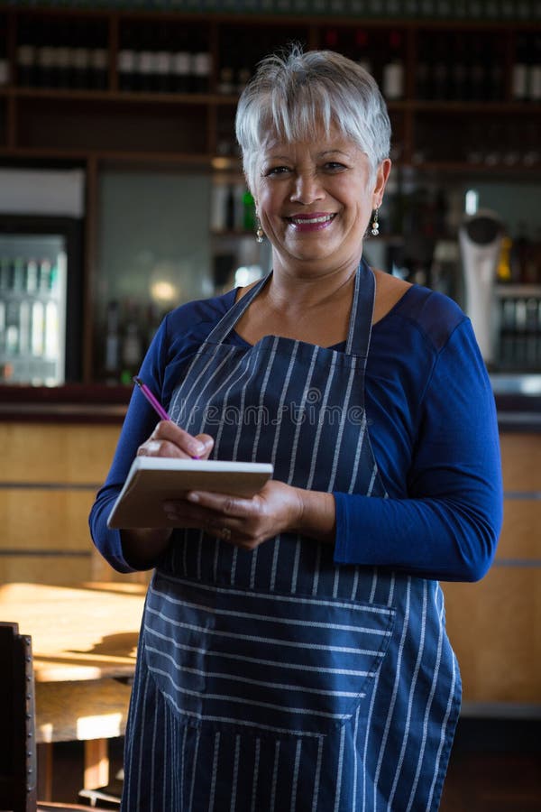 Waitress Writing an Order in the Notepad in the Bar Stock Image - Image ...