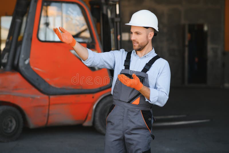 Portrait of Warehouse Forklift Driver Standing in Storehouse by the ...