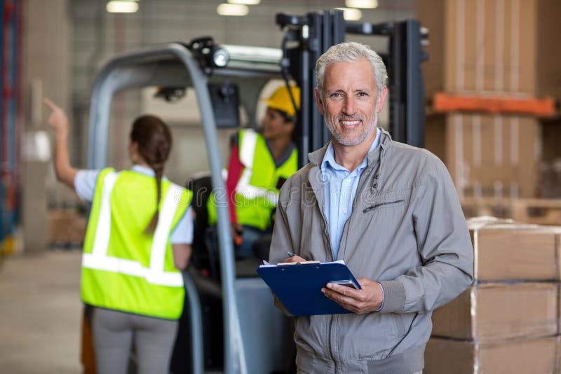 Portrait of Warehouse Manager Holding a Clipboard Stock Image - Image ...