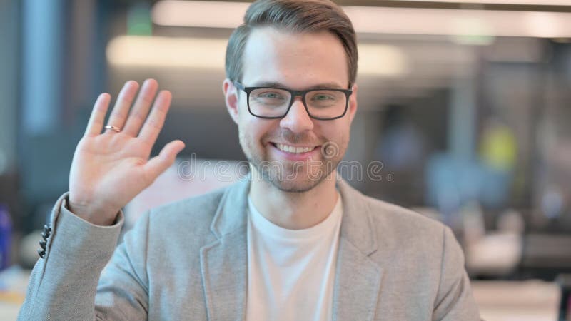 Portrait of Welcoming Young Man Waving for Hello Stock Photo - Image of ...