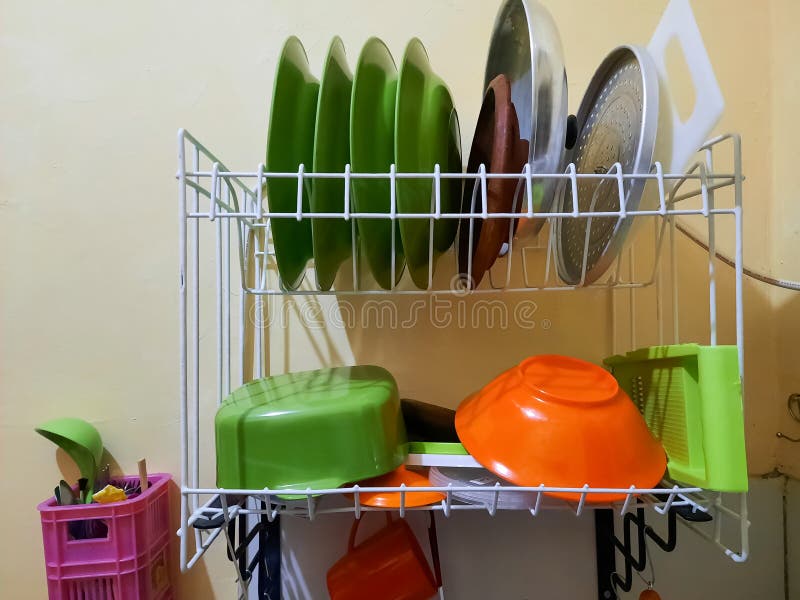 Portrait of a White Iron Plate Rack and Tableware, Green, Orange and ...