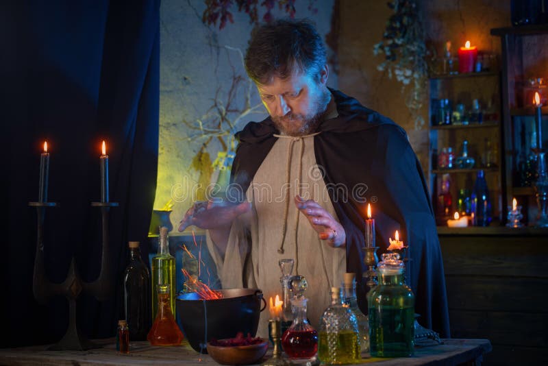 Wizard with Burning Candles and Magic Potions Stock Image - Image of ...