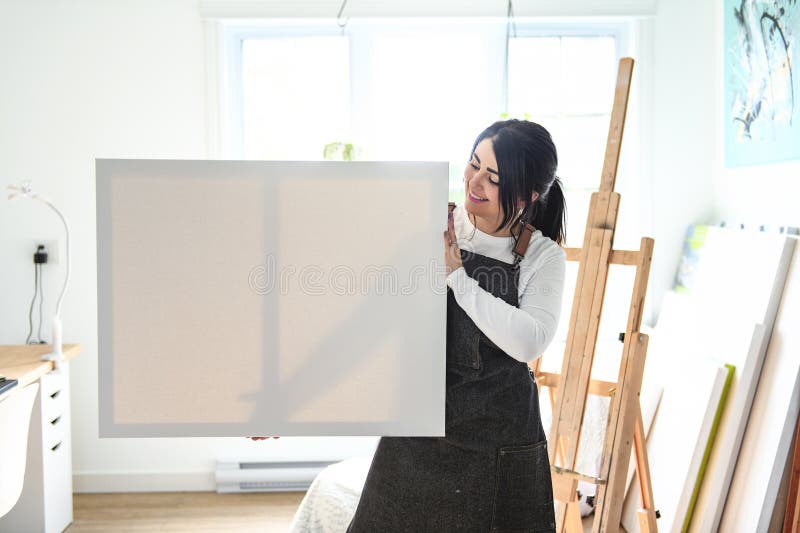 Portrait of a Woman Artist with Canvas Projects on Her Studio Stock ...