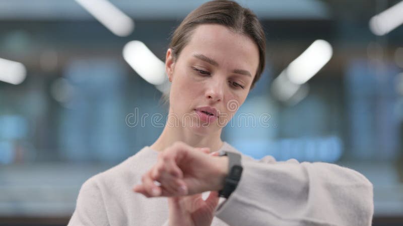 Portrait of Woman Checking Smart Watch while Waiting Stock Image ...