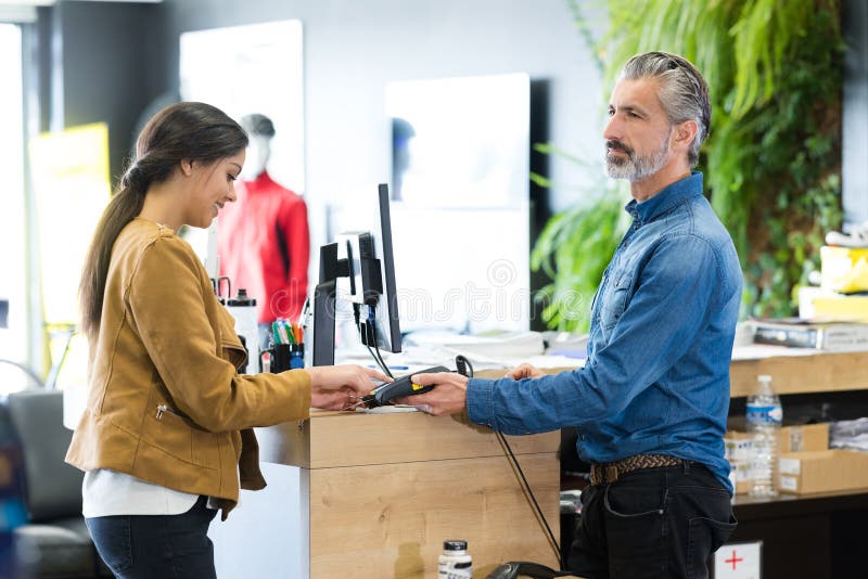 Portrait woman at checkout stock image. Image of service - 180838153