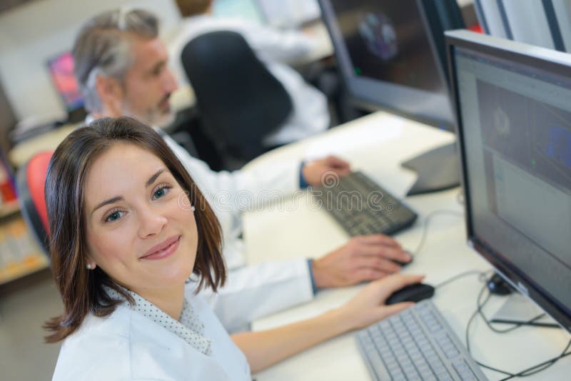Portrait Woman at Computer Station Stock Photo - Image of women, smile ...