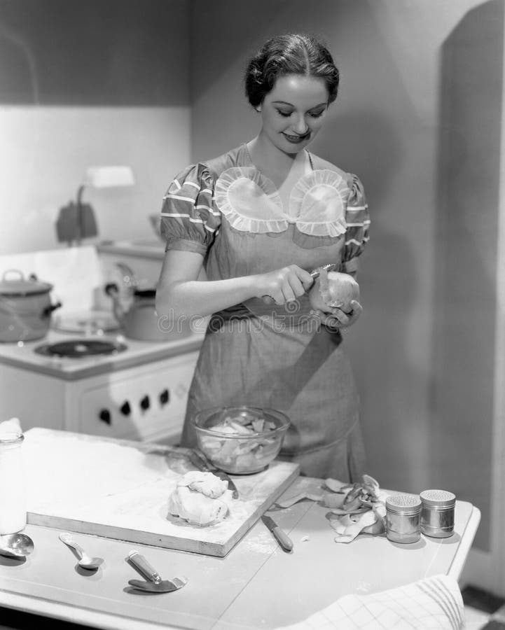 Woman Cooking on Antique Stove Stock Image - Image of busy, apron: 52004613