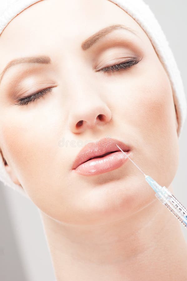 Portrait of a Woman Injecting Botox into Her Lip Stock Photo - Image of ...