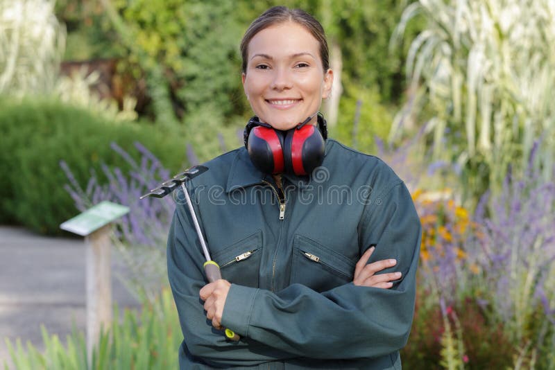 Portrait woman with rake stock photo. Image of adult - 238087070