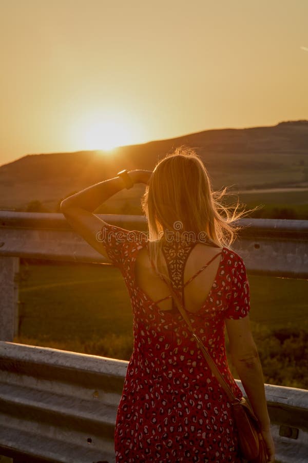 Woman Seen from Behind Looking at the Sunset Stock Image - Image of ...