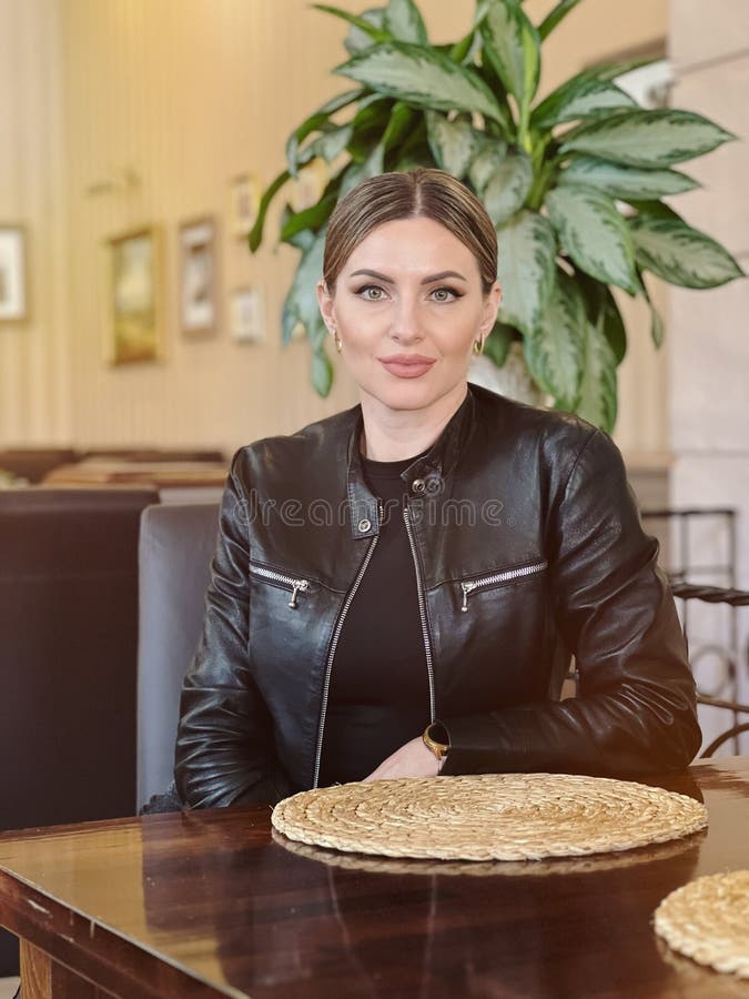 Portrait of a Woman Sitting at a Table in a Cafe Stock Image - Image of ...