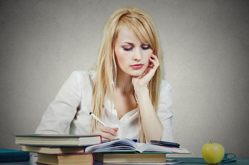 Portrait of a Woman a Student Sitting at Desk and Writing in Her ...