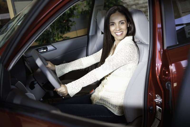 Portrait of a Woman Taking a Test Drive Stock Photo - Image of smiling ...