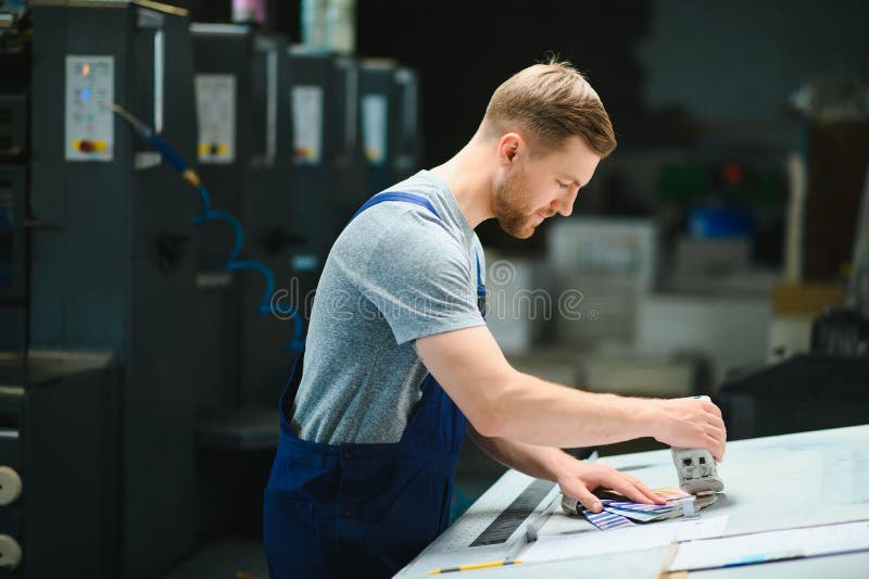 Portrait of Worker at Control Room Checking Print Quality at Printing ...